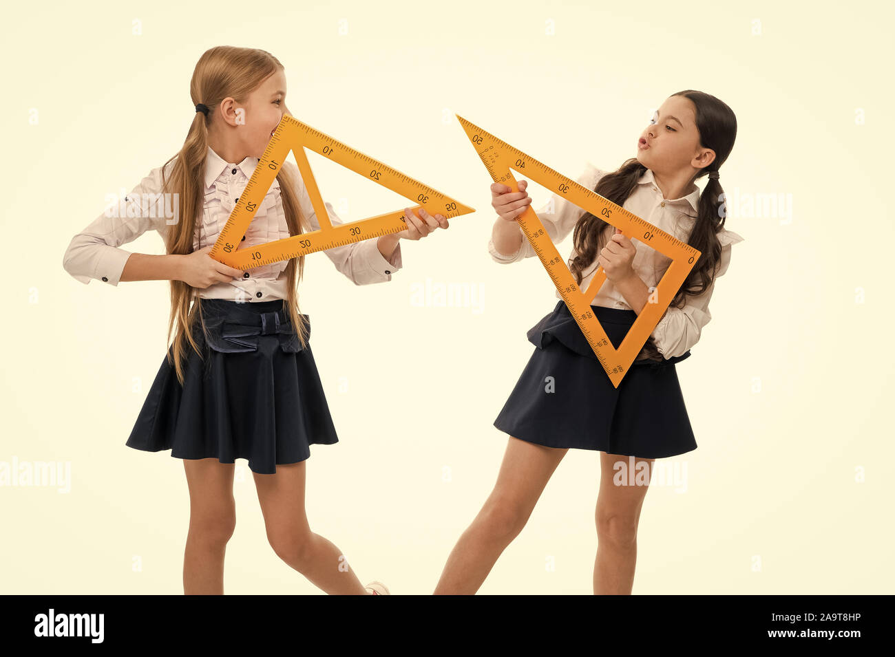 Education and school concept. School students learning geometry. Kids ...
