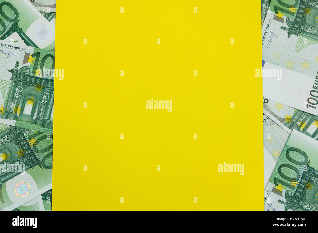 Many Banknotes of 100 Euro with yellow copy space, the European ...