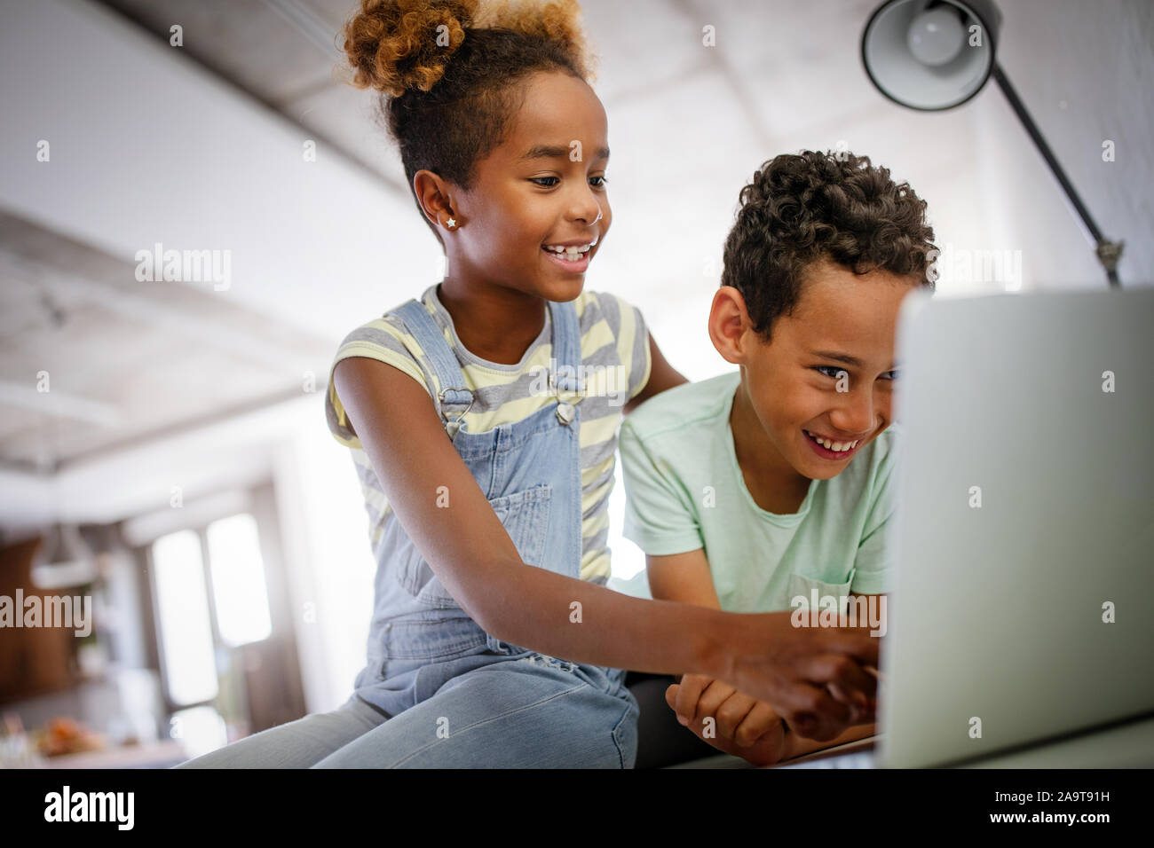 Game, study, fun concept. Happy children spending time with notebook ...