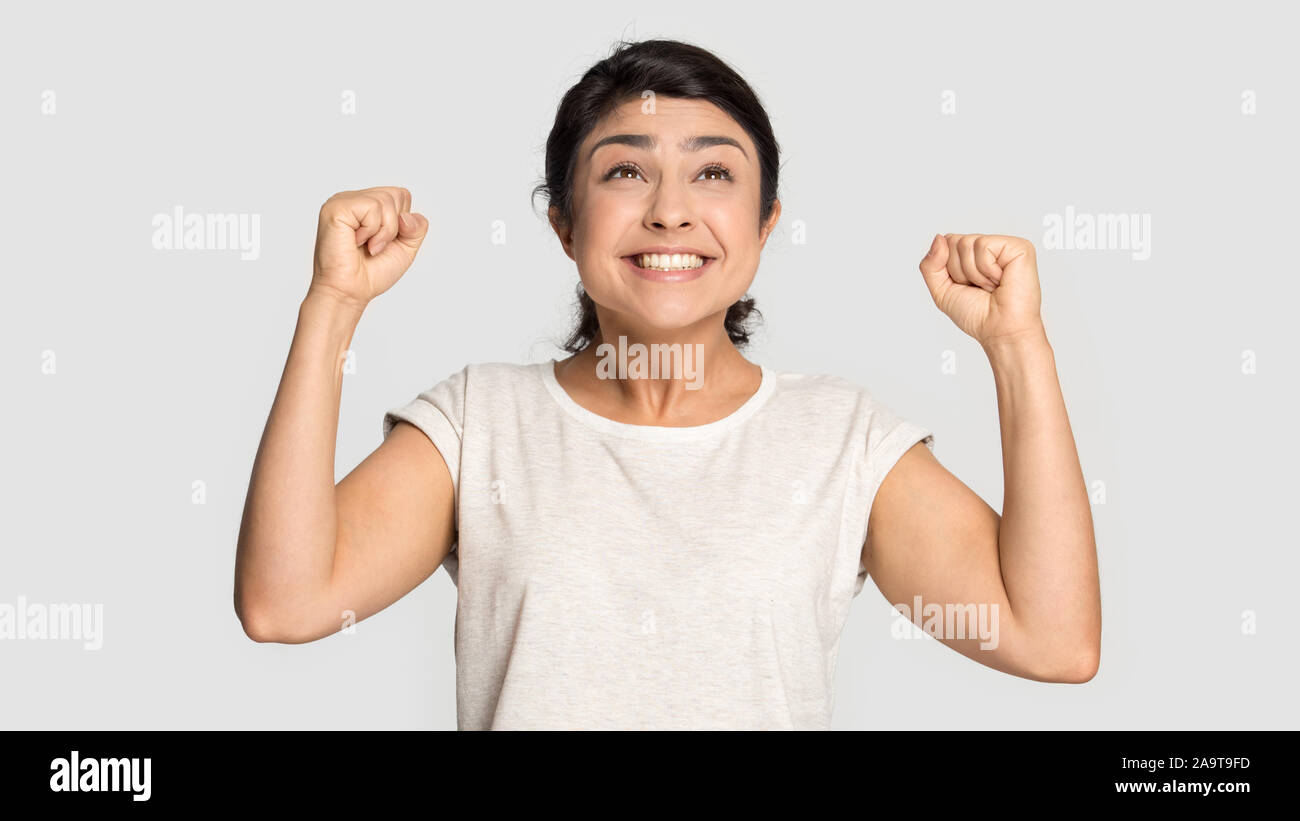 Excited overjoyed Indian woman celebrating win close up Stock Photo - Alamy