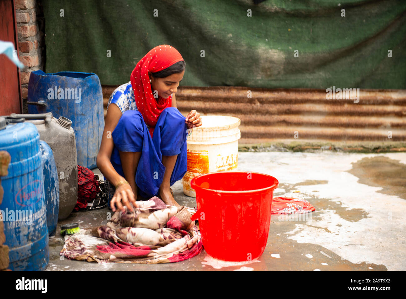 Woman washing clothes Stock Photo - Alamy