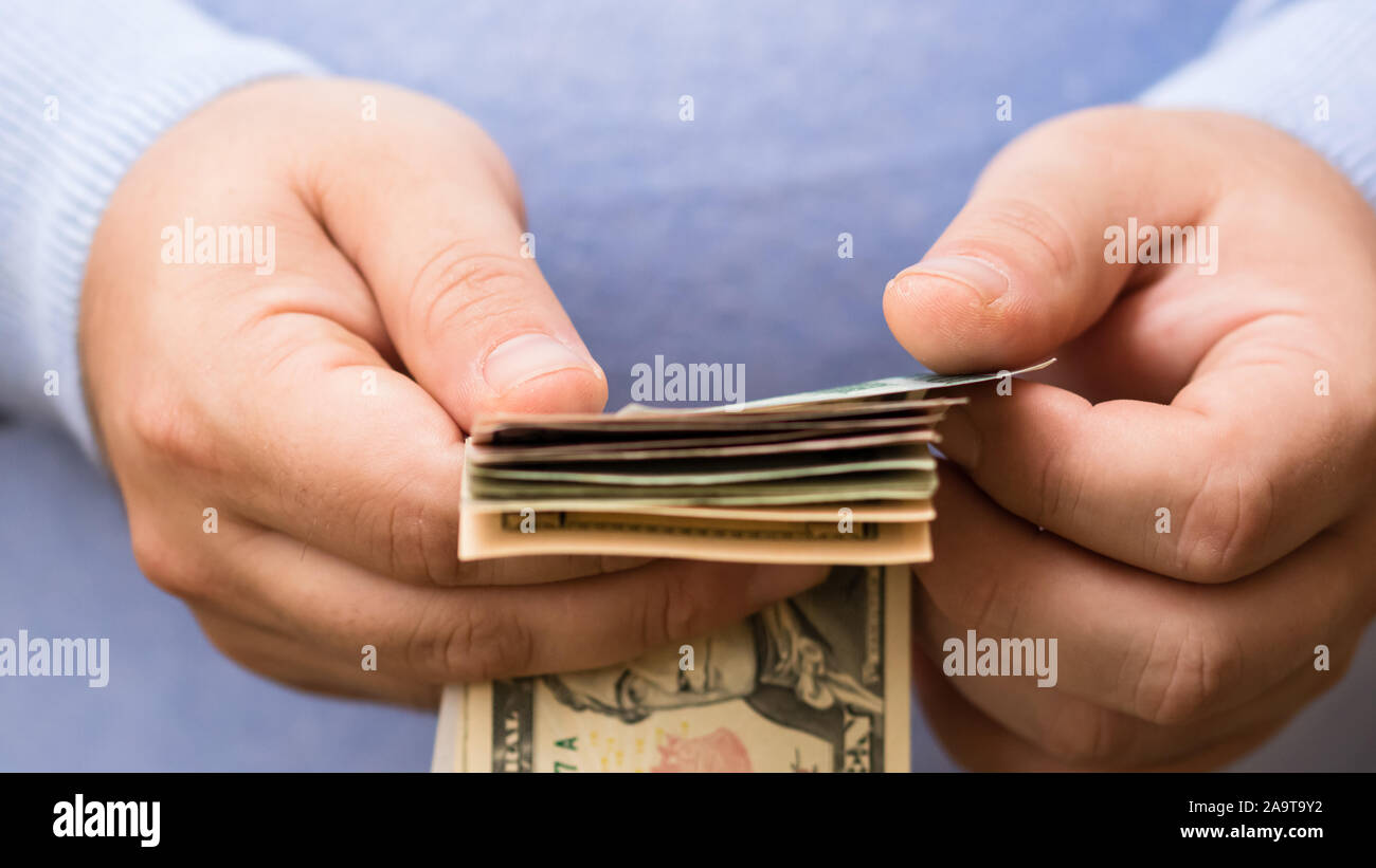 Man hands counting money, counting US dollars currency, close up Stock ...