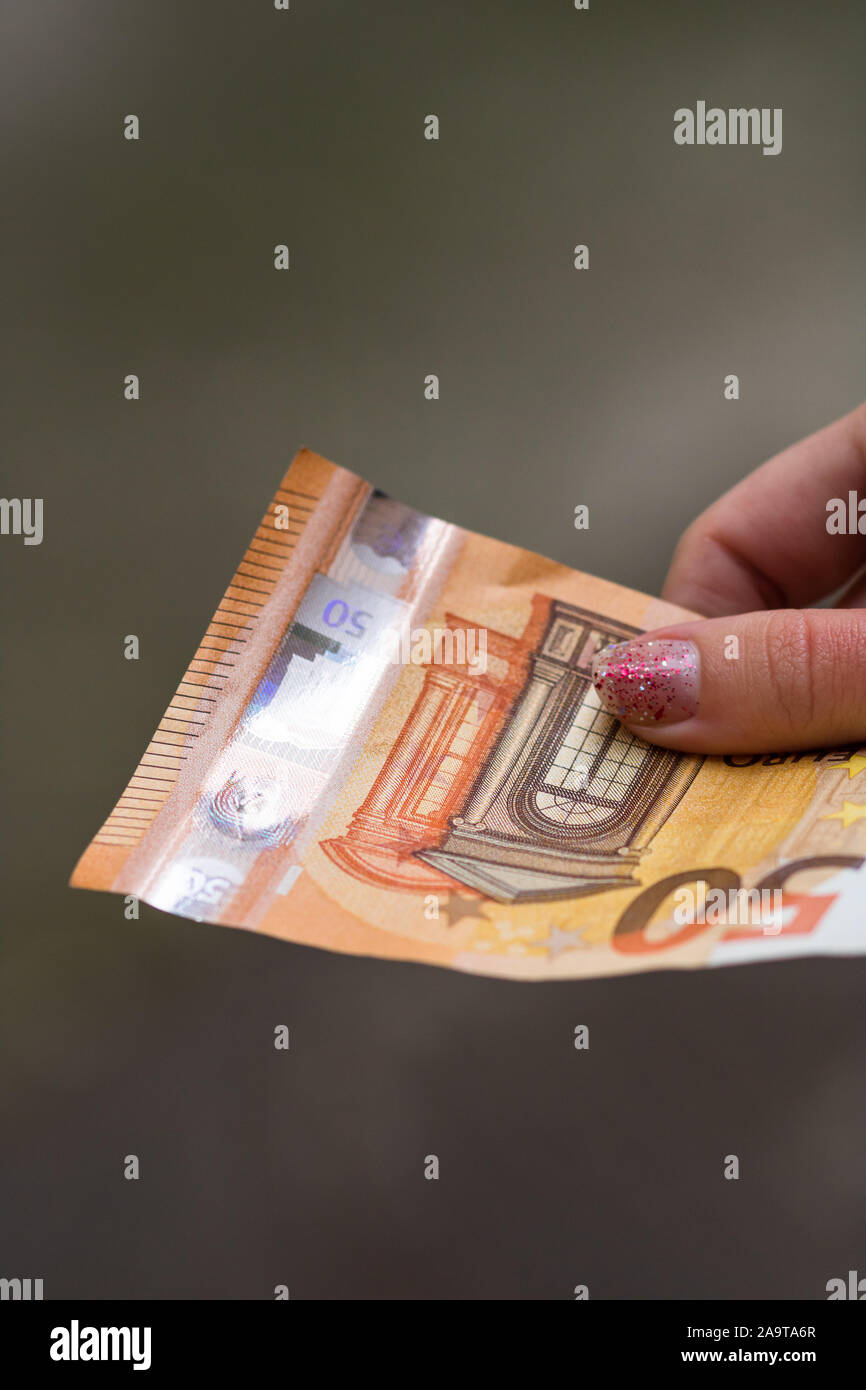 Businesswoman giving euro banknotes hi-res stock photography and images ...