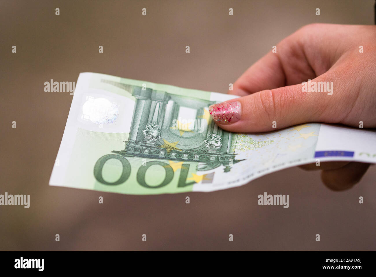 Businesswoman giving euro banknotes hi-res stock photography and images ...