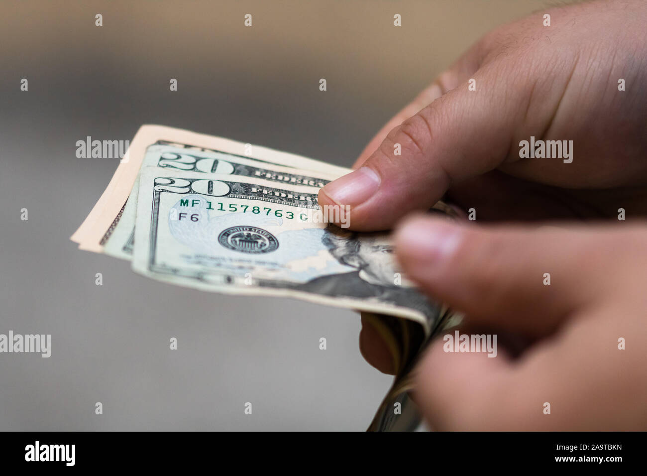 Man hands counting money, counting US dollars currency, close up Stock ...