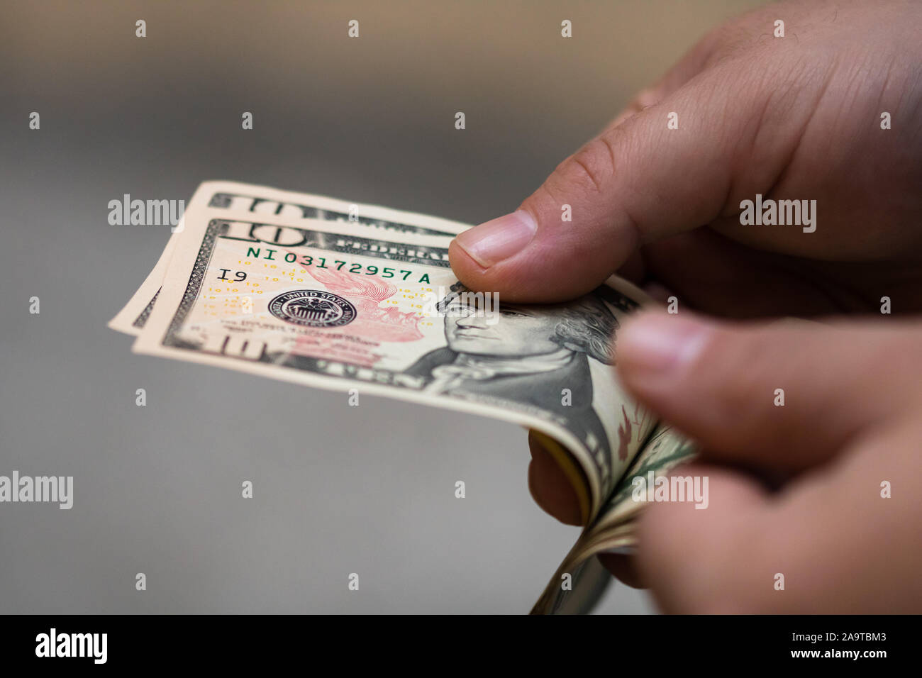 Man hands counting money, counting US dollars currency, close up Stock ...