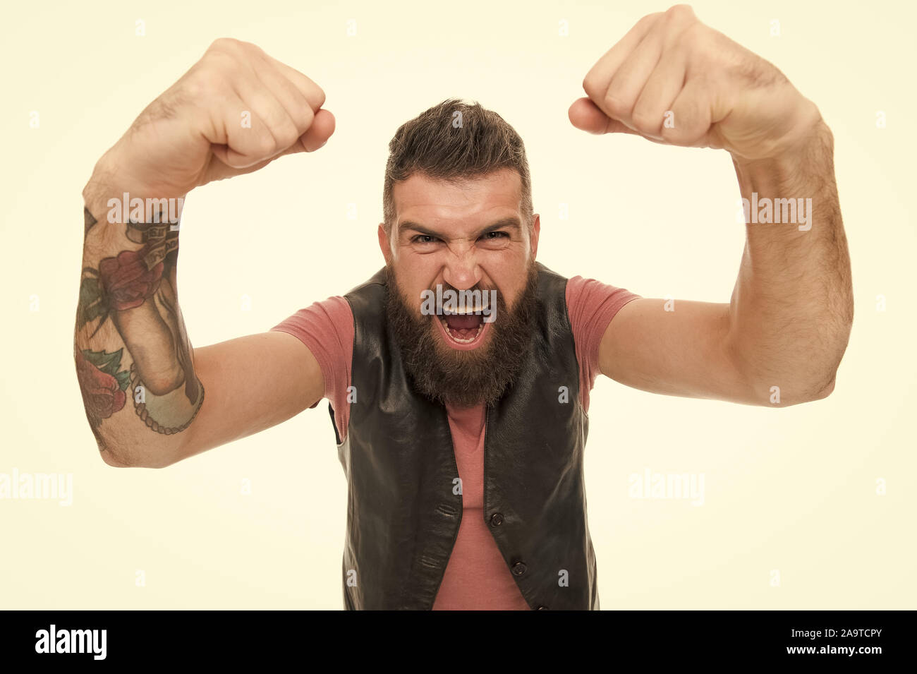 His tattoo is perfect. Angry man showing his arms with tattoo. Brutal ...