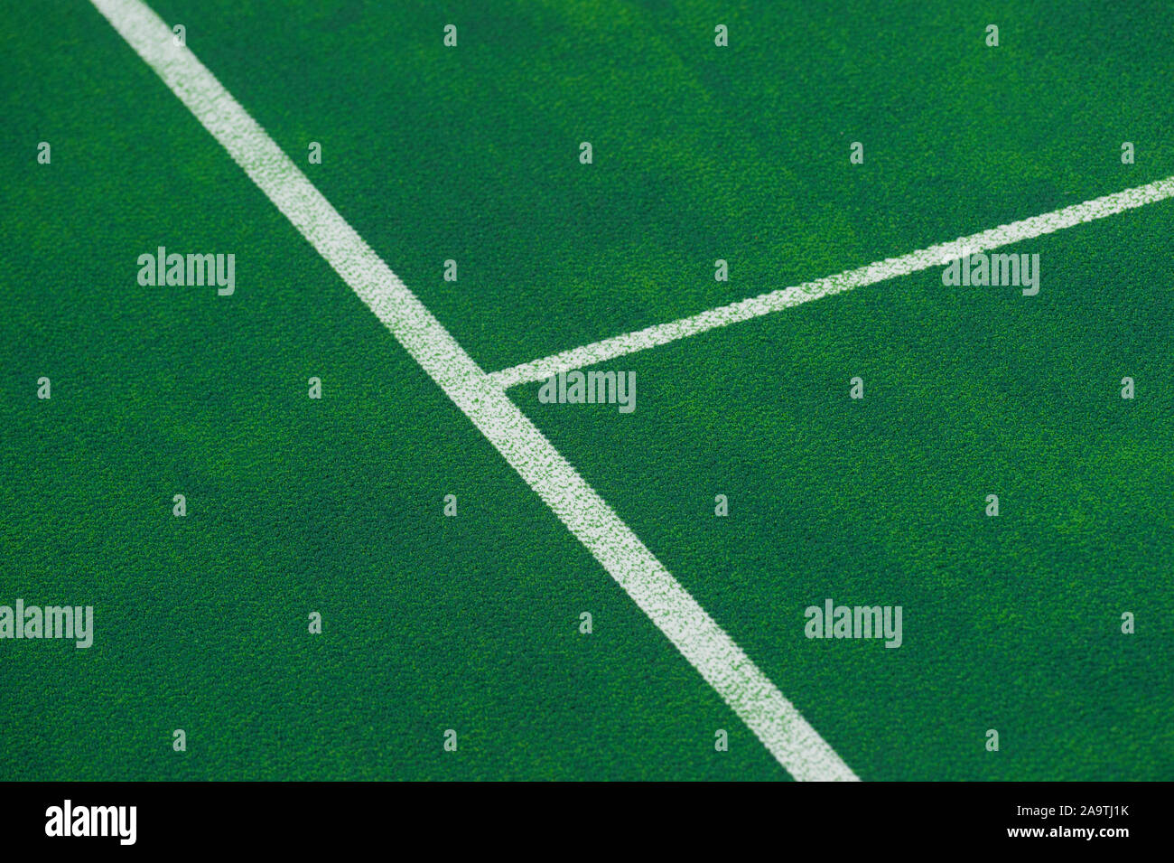 Tennis court indoor with green carpet surface Stock Photo - Alamy
