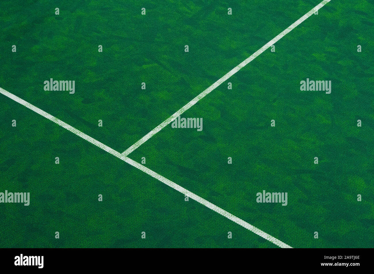 Tennis court indoor with green carpet surface Stock Photo - Alamy