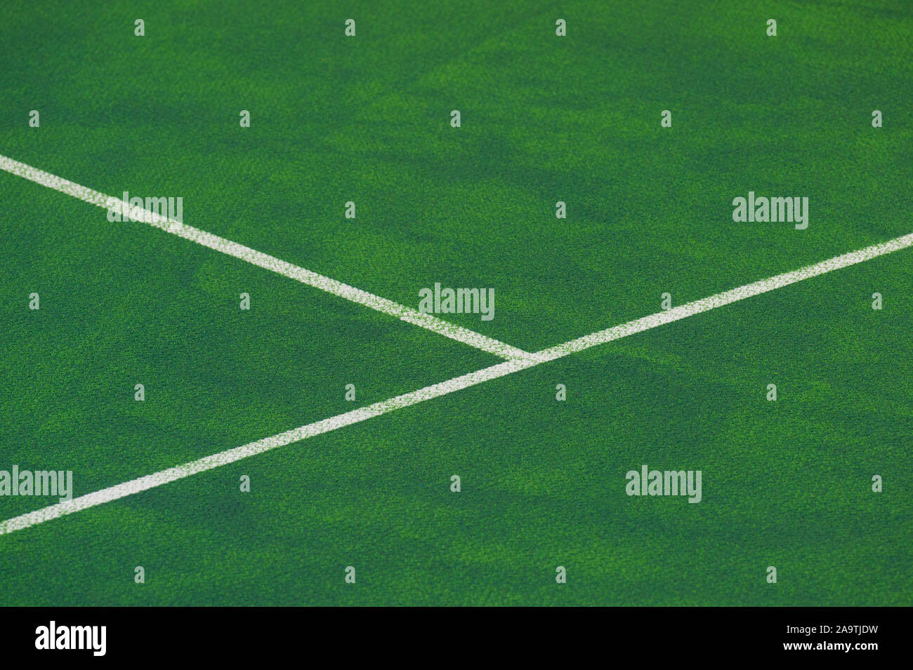 Tennis court indoor with green carpet surface Stock Photo - Alamy
