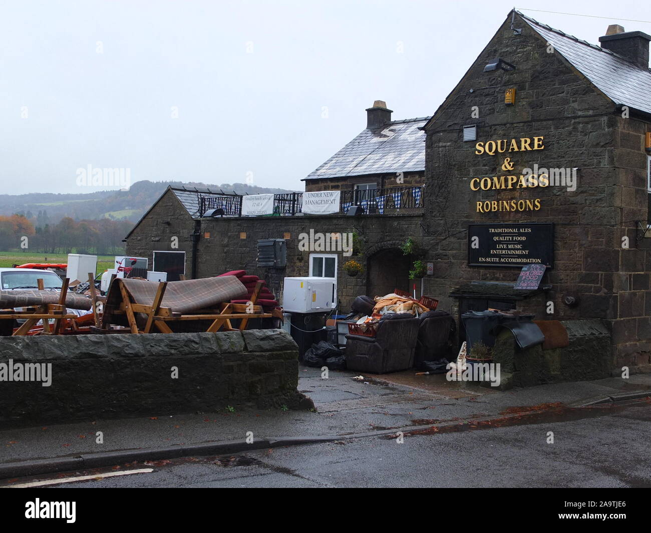 Ruined furniture piled up in car park of flood damaged pub Square ...