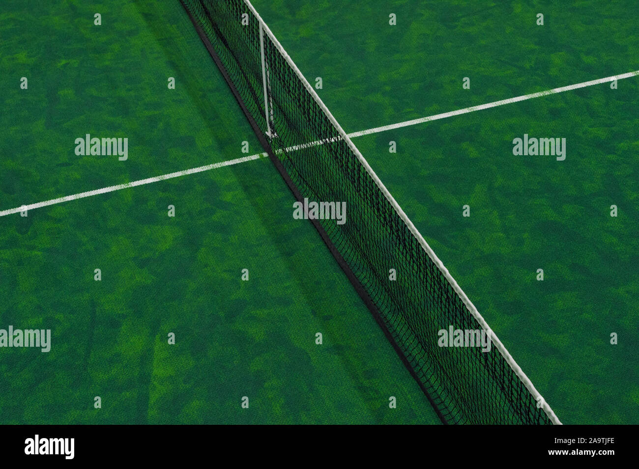 Tennis court indoor with green carpet surface Stock Photo - Alamy