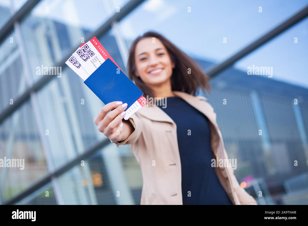 Travel Closeup Of Girl Holding Passports And Boarding Pass At Airport