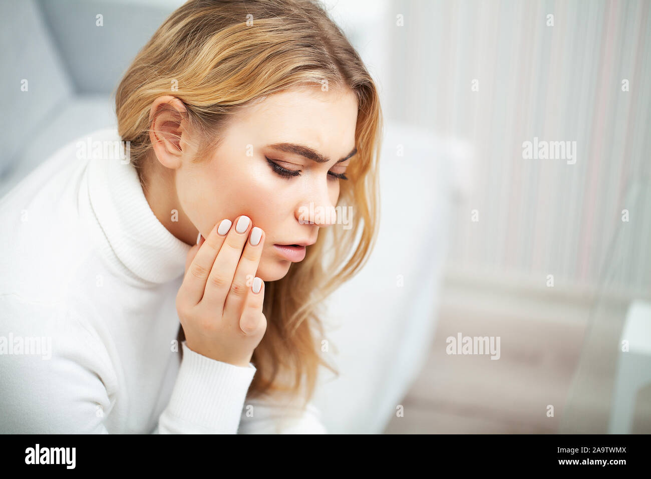 Pain. The problem of teeth. A woman feels pain in her tooth. A picture ...