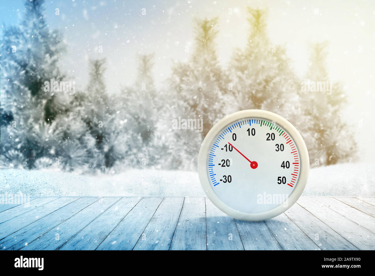 The thermometer on a wooden table with the low temperature at winter ...