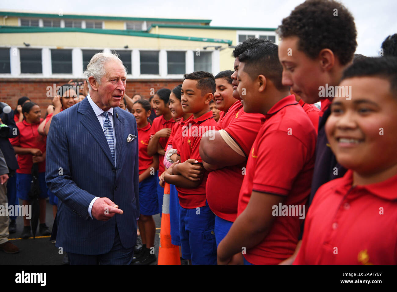 The Prince of Wales meets children during a visit to Wesley ...