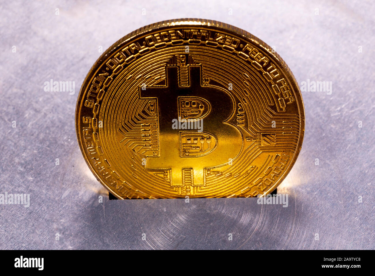 Virtual cryptocurrency money Bitcoin golden coin in an aluminium. The ...