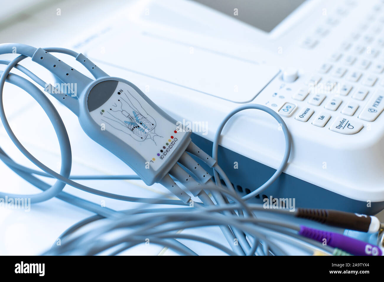 A device for conducting an ECG, a wire from sensors and an arrangement ...