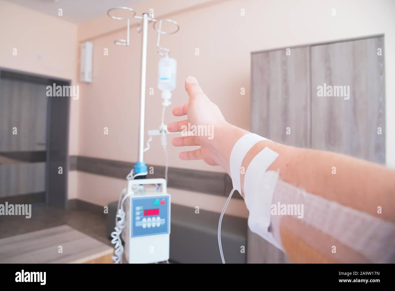 Intravenous drip arm hi-res stock photography and images - Alamy