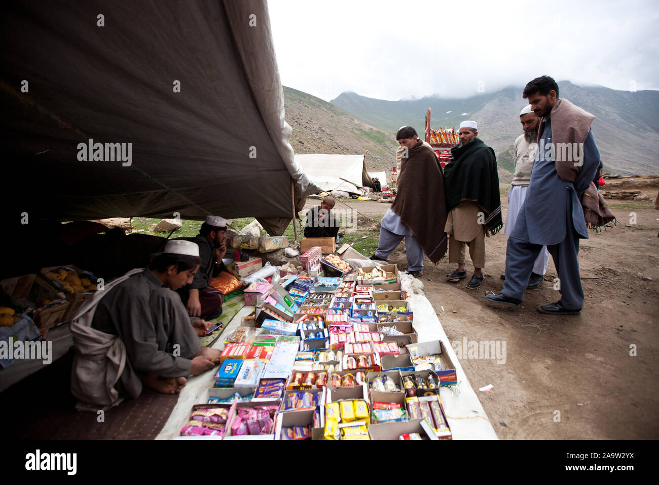 Pathan (men from the Northern Parts of Pakistan) stand around a tent ...