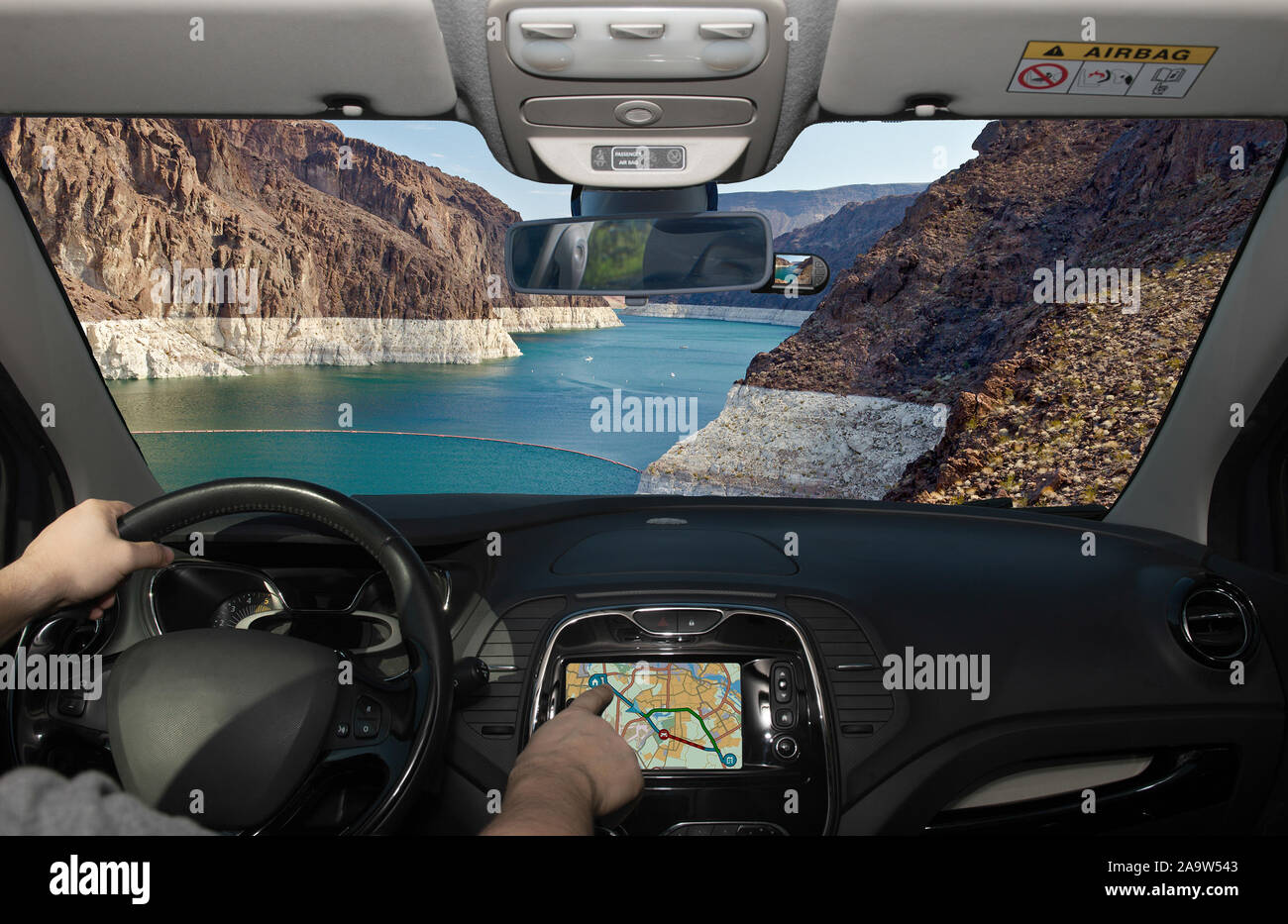 Driving a car while using the touch screen of a GPS navigation system ...