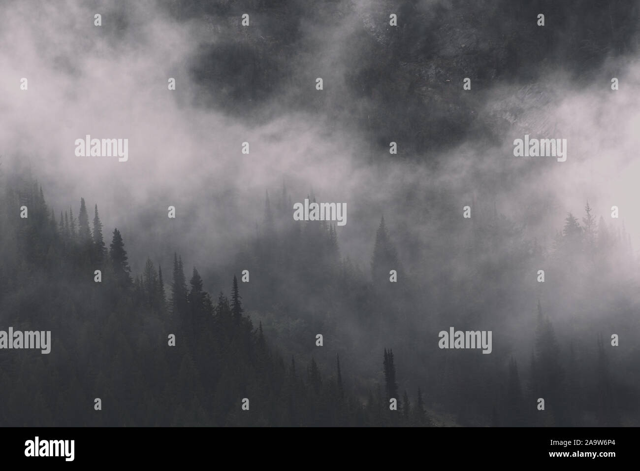 Storm clouds and mist moving around volcanic landscape of the North ...