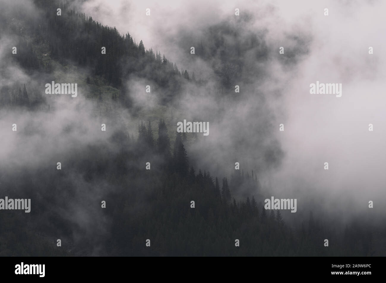Storm clouds and mist moving around volcanic landscape of the North ...