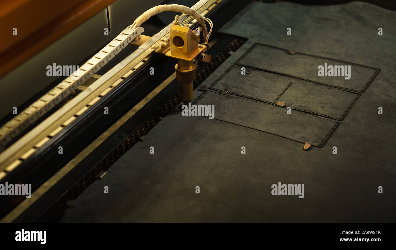 Laser cutting beam artificial leather High precision. Modern machine ...