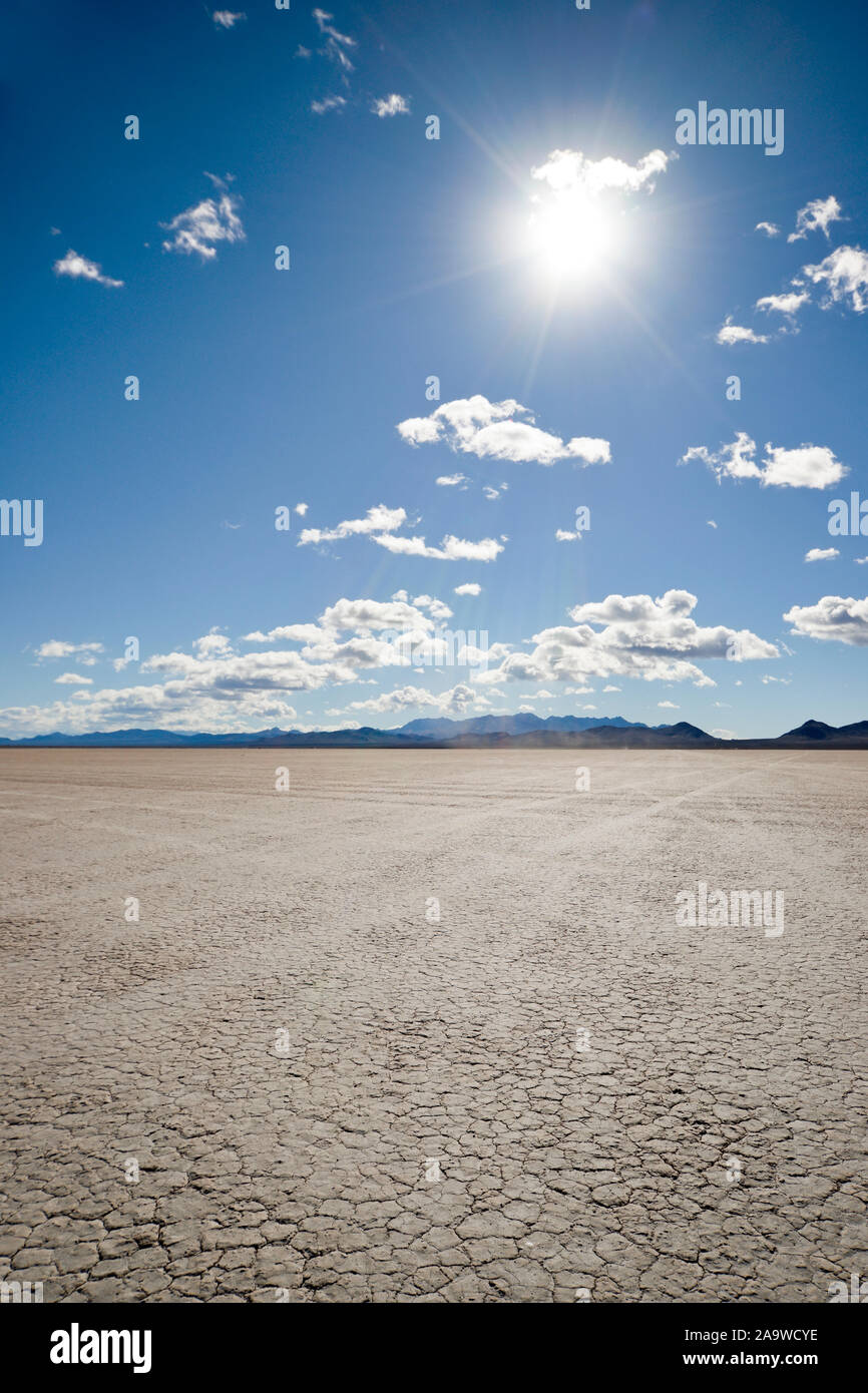 A dry lake bed and blue sky Stock Photo - Alamy