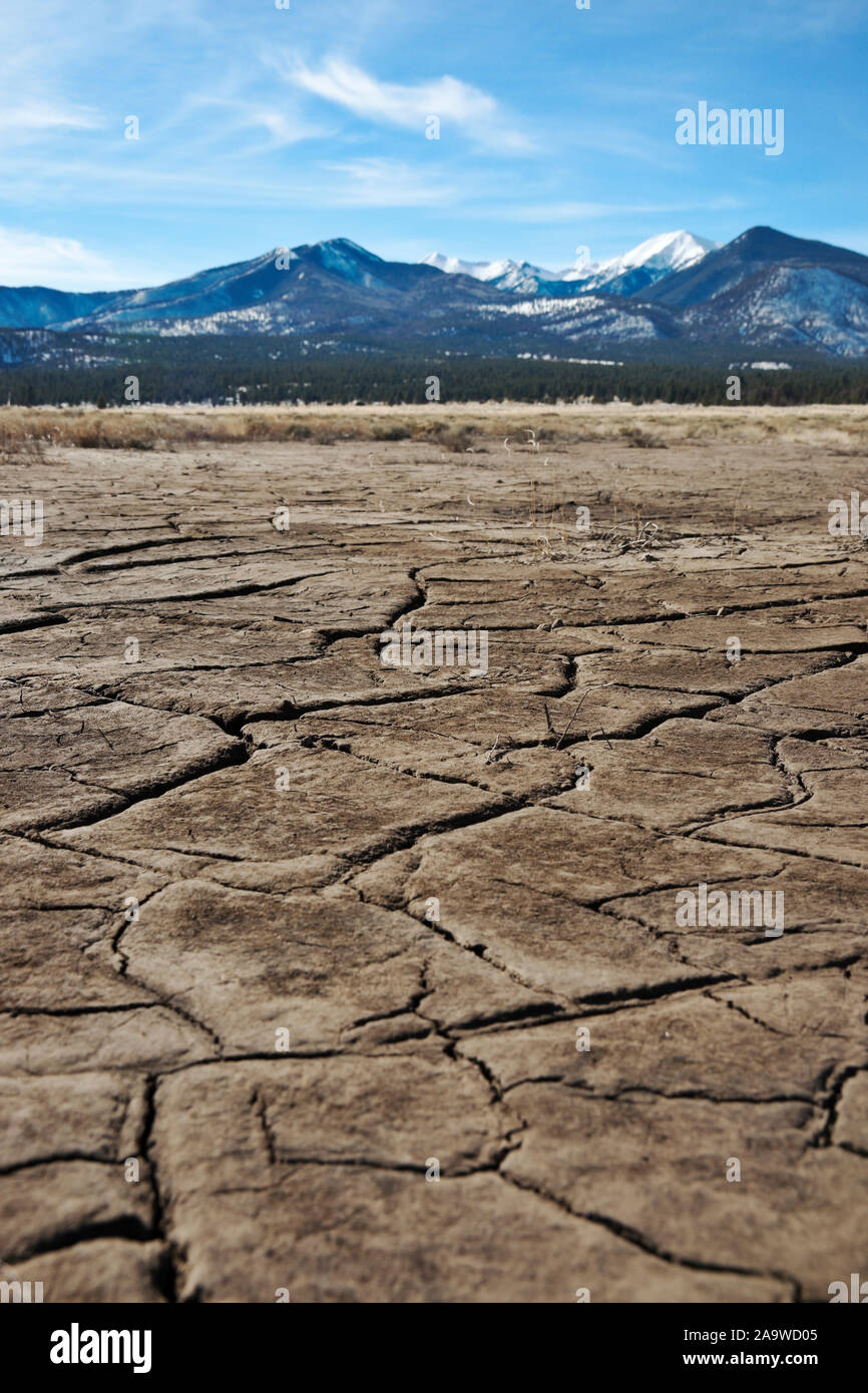 A dry lake bed and blue sky Stock Photo - Alamy