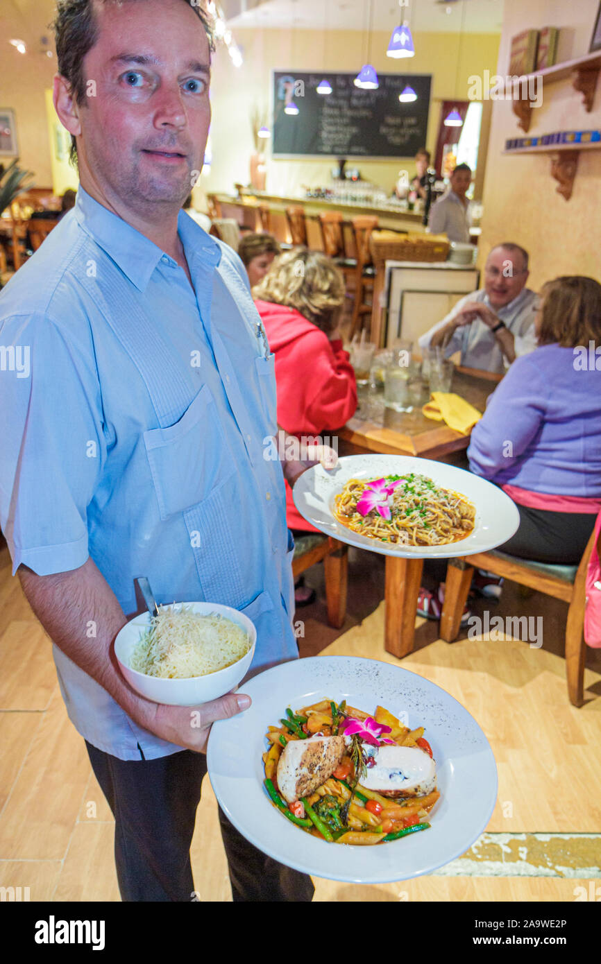 Waiters serving dish hi-res stock photography and images - Alamy