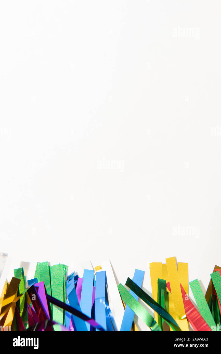 Isolated blue, pink, green, yellow and red party streamers on white ...