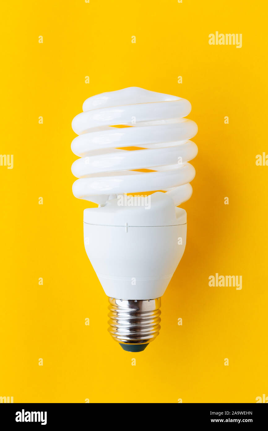 Energy saving lights on a yellow background Stock Photo - Alamy
