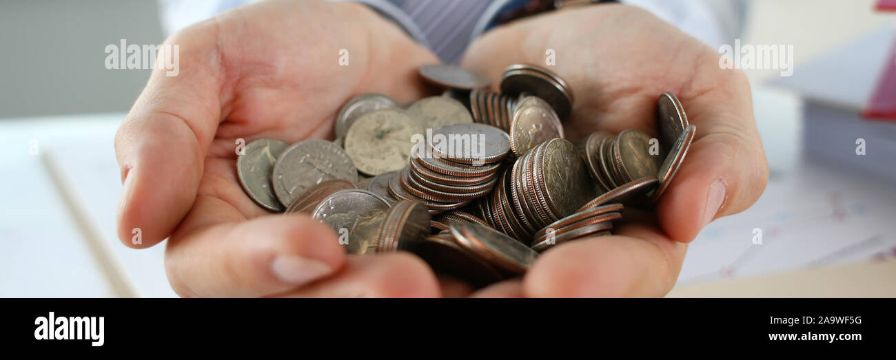 Hand businessman putting pin money Stock Photo - Alamy