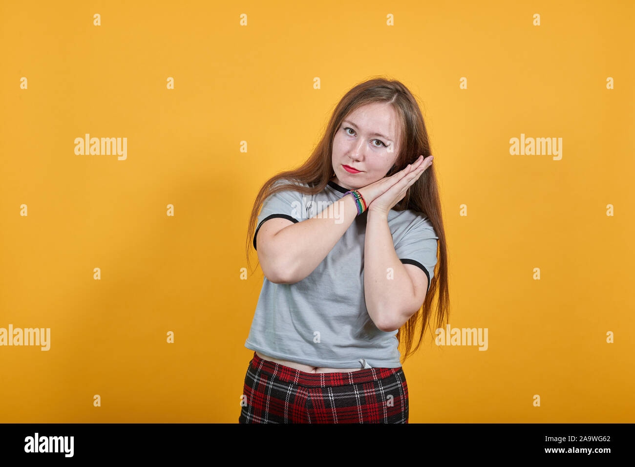 Gorgeous young caucasian girl making sleep gesture in dorable ...