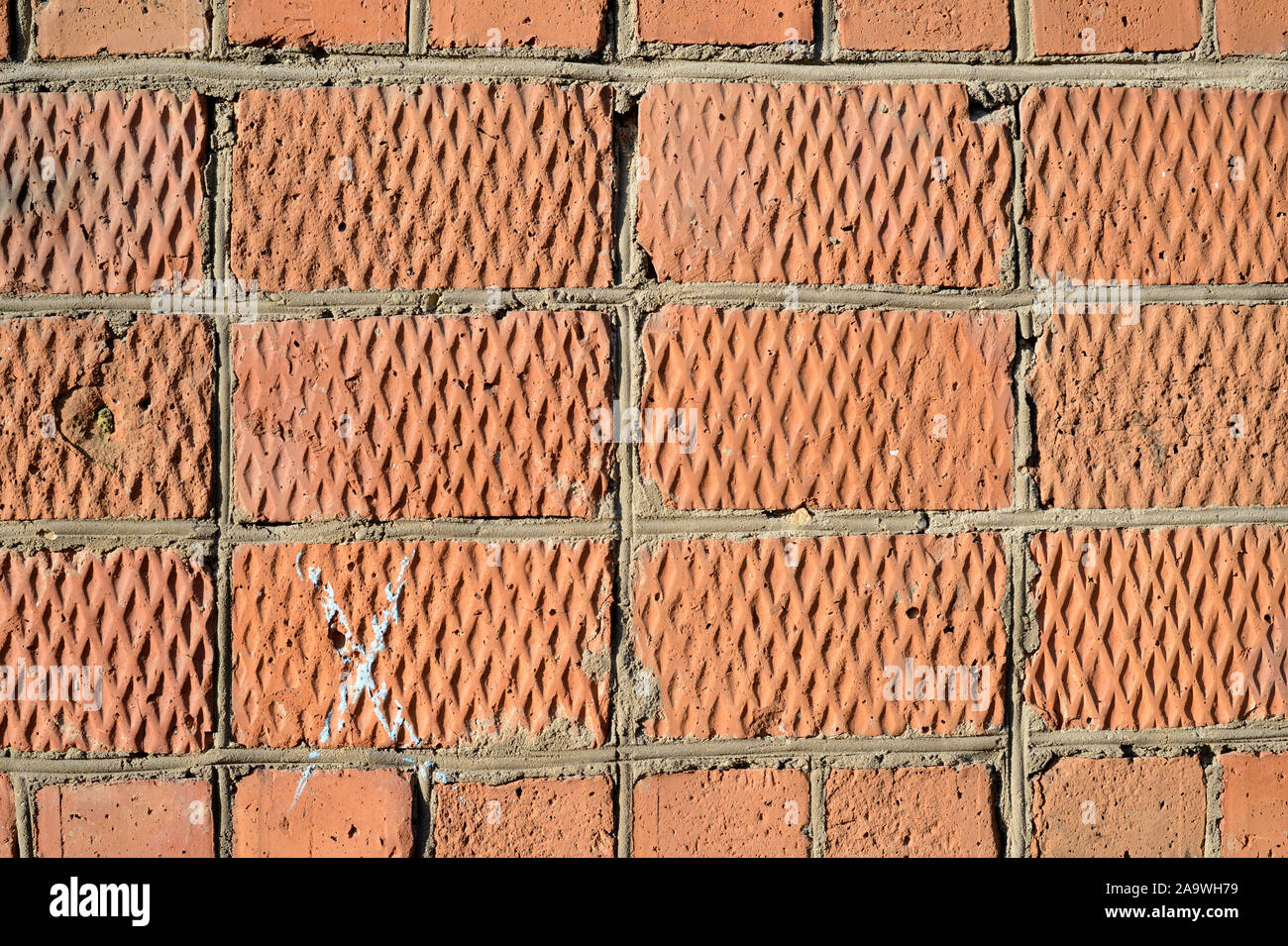 Old red brick wall lit by the sun closeup. Abstract background Stock ...