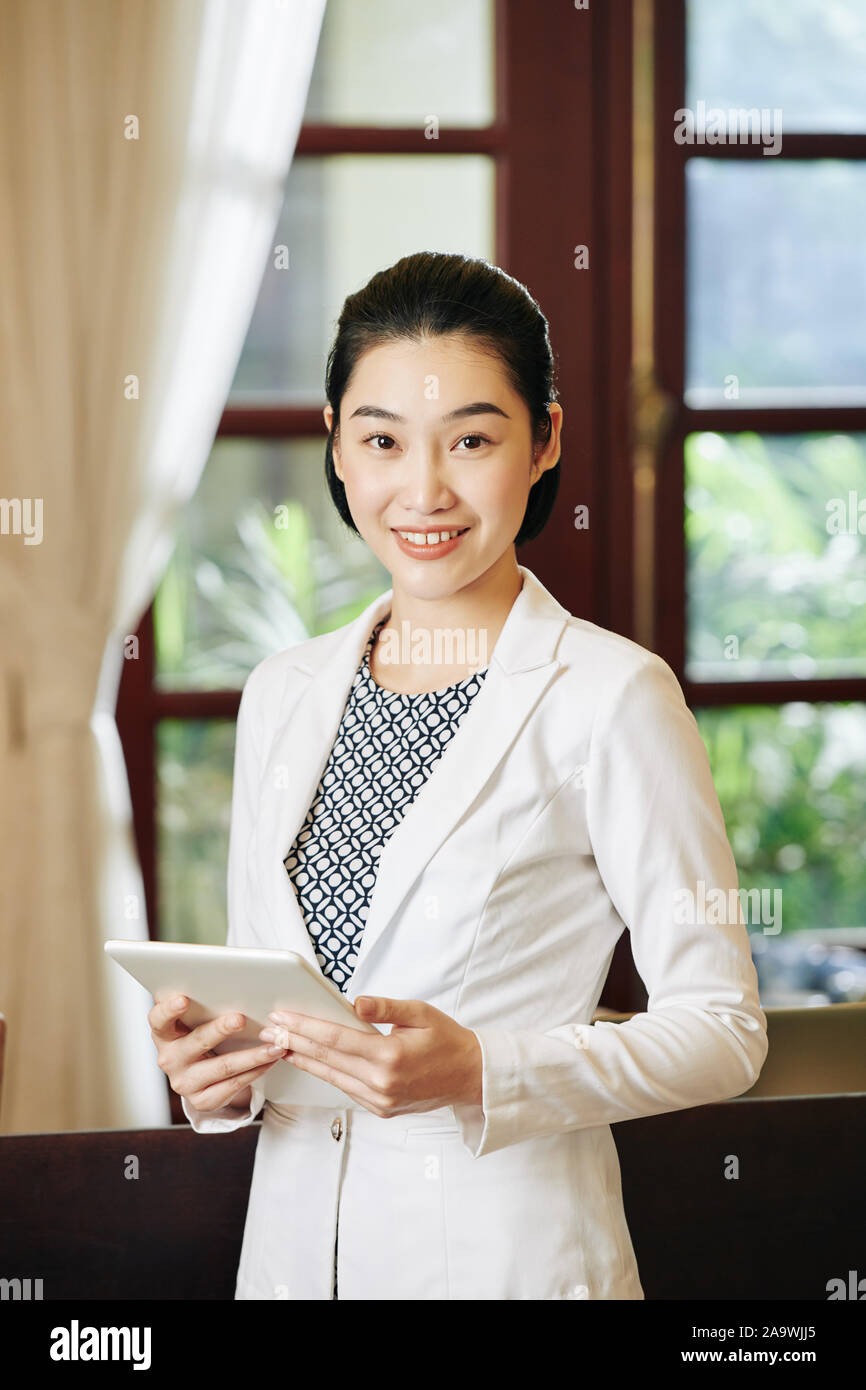Hotel receptionist tablet hi-res stock photography and images - Alamy