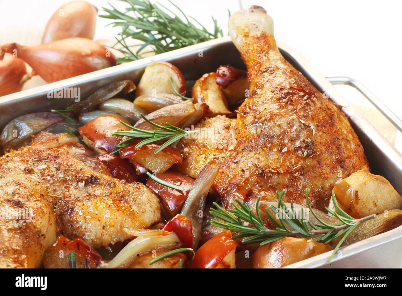 Roast Legs Of Duck With Vegetables In An Oven Dish Stock Photo - Alamy