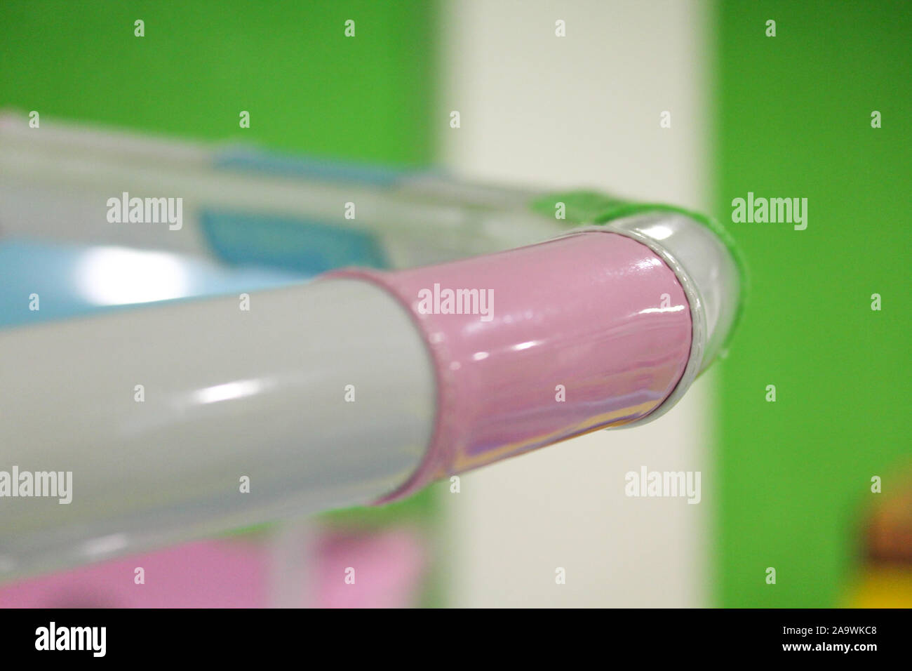 Colorful soft railing of attraction on kids playground. Bright ...