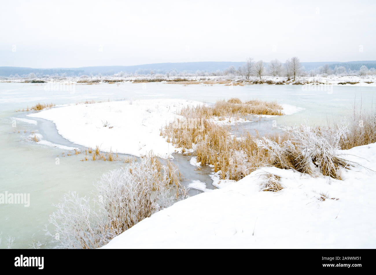 winter landscape of lake covered with ice Stock Photo - Alamy