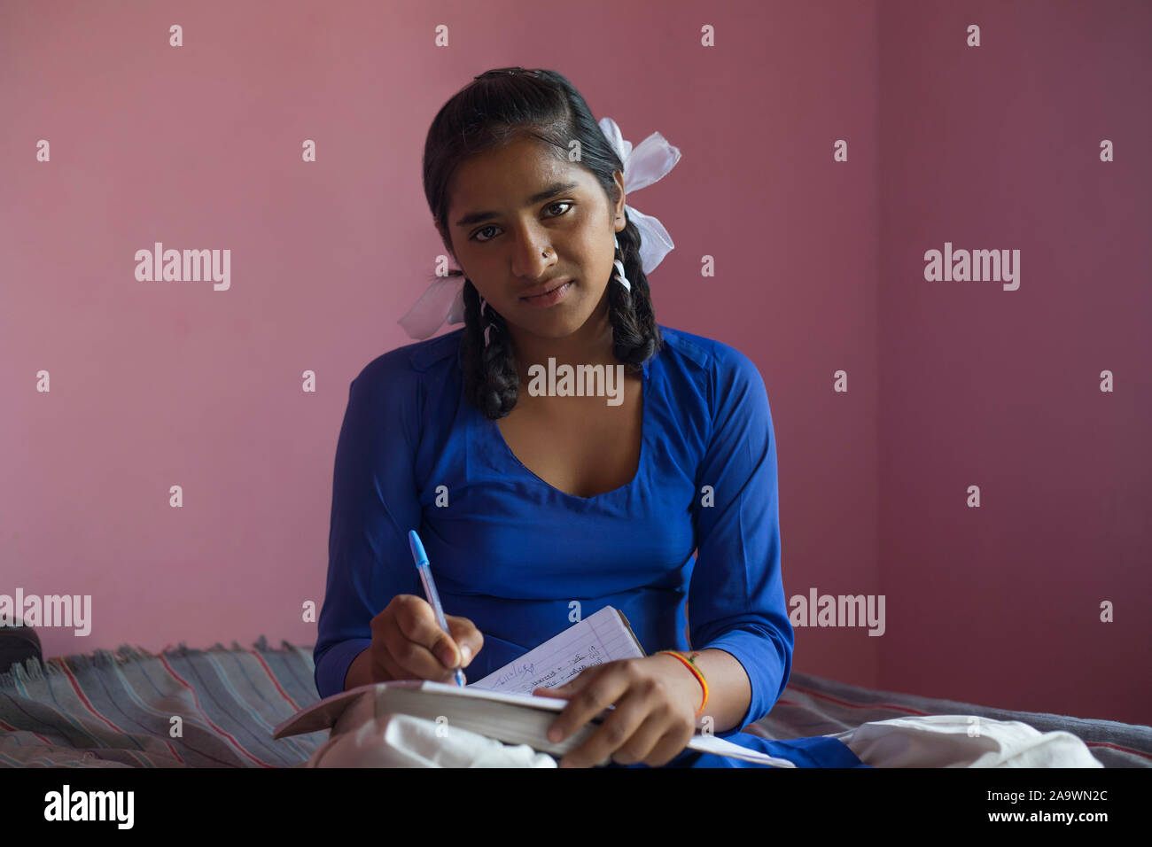 school girl writing in her notebook Stock Photo - Alamy