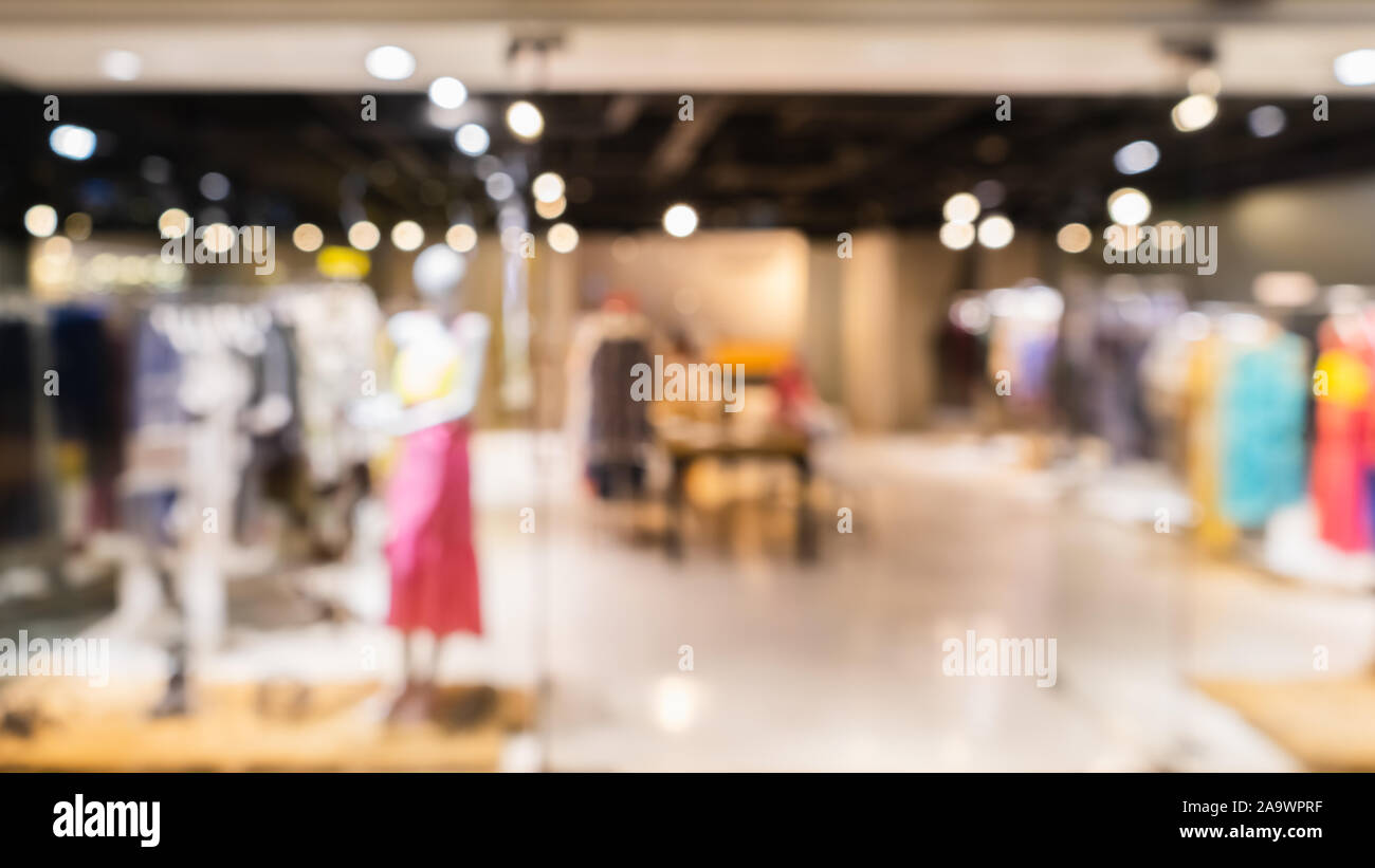Abstract blurry modern fashion clothes store in a shopping mall for ...