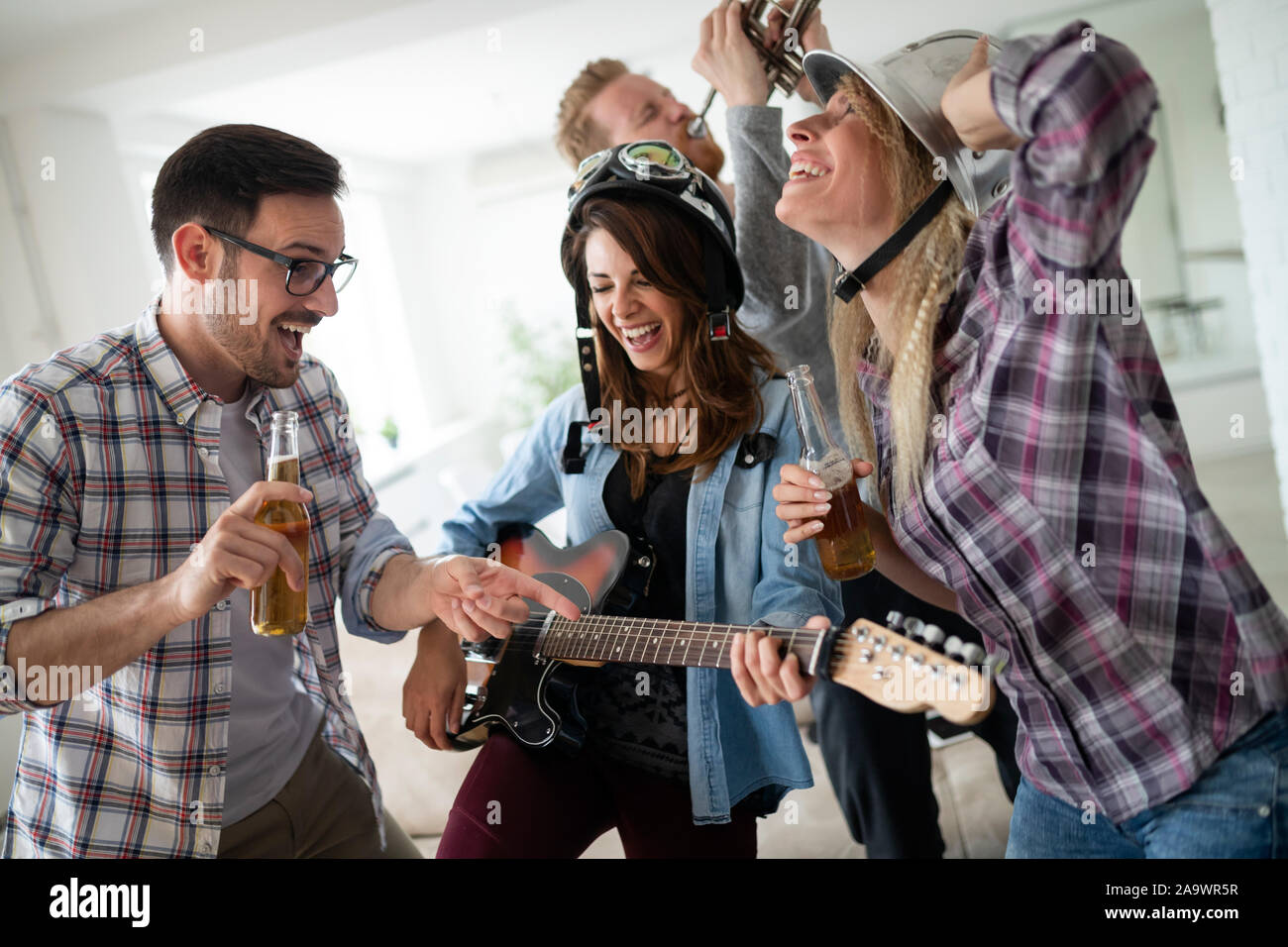 Group of happy friends having fun and party Stock Photo - Alamy