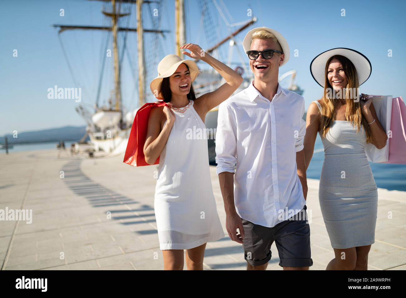 Vacation, travel, sea, friendship and people concept. Smiling friends ...