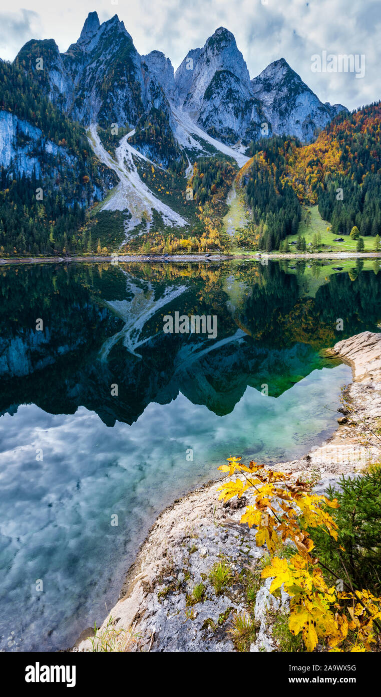 Sunny idyllic colorful autumn alpine view. Peaceful mountain lake with ...