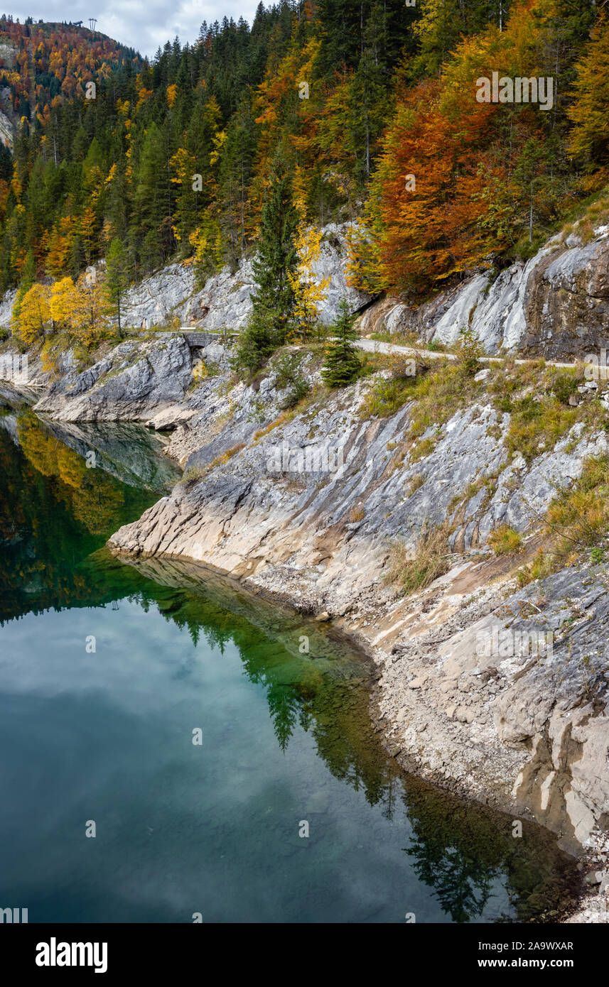 Sunny idyllic colorful autumn alpine view. Peaceful mountain lake with ...