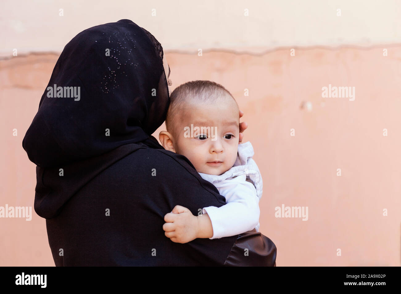 Mom hugging son in childcare hi-res stock photography and images - Alamy