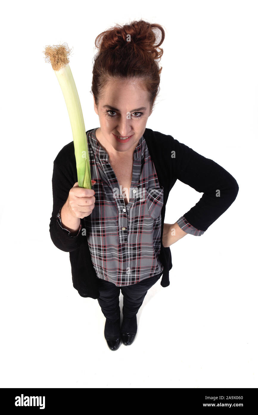 portrait of a woman with leek on white background Stock Photo - Alamy