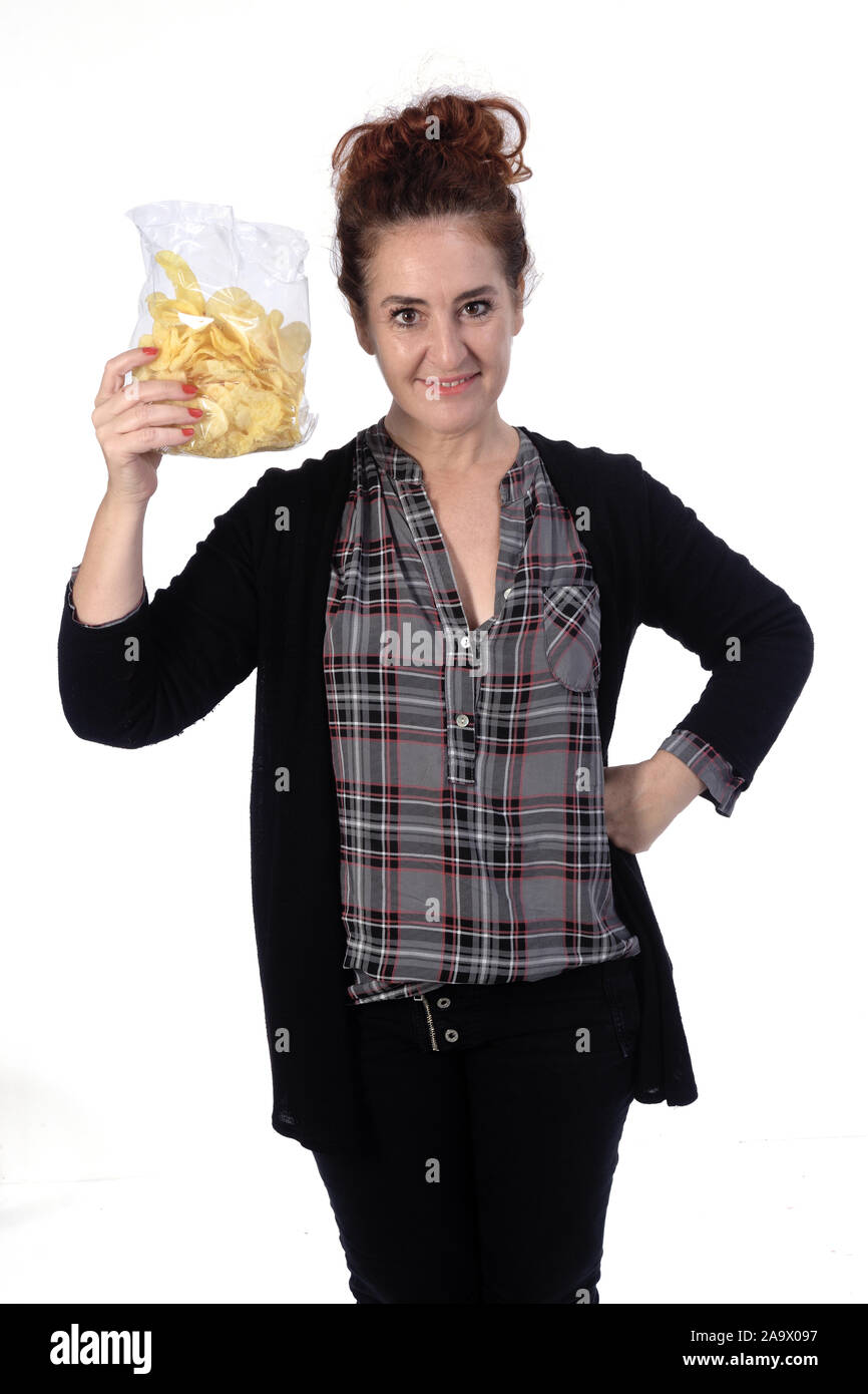 woman with chips on white background Stock Photo - Alamy