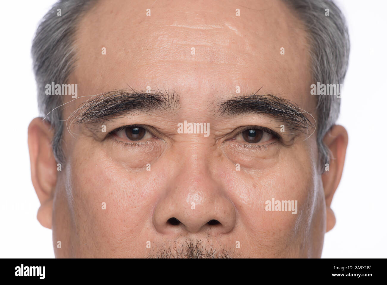 Face of elderly man looking at camera Stock Photo - Alamy